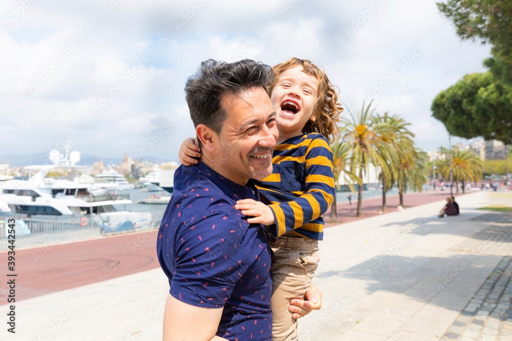 Spain, Barcelona, father and son playing together and having fun Stock ...