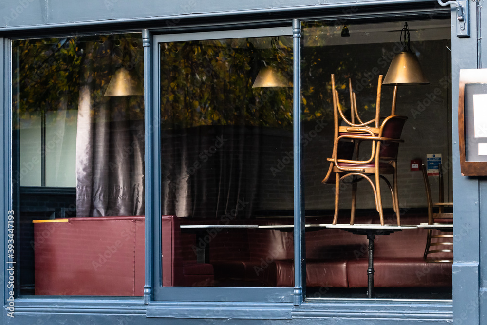 Window of an empty restaurant forced to close amid COVID-19 pandemic ...
