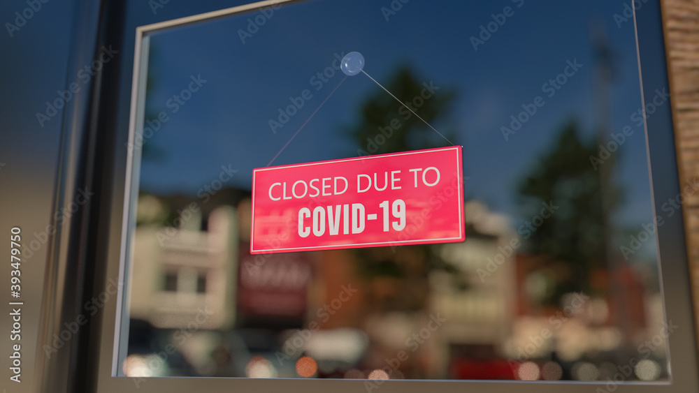 Close-up on a closed sign in the window of a shop displaying the ...