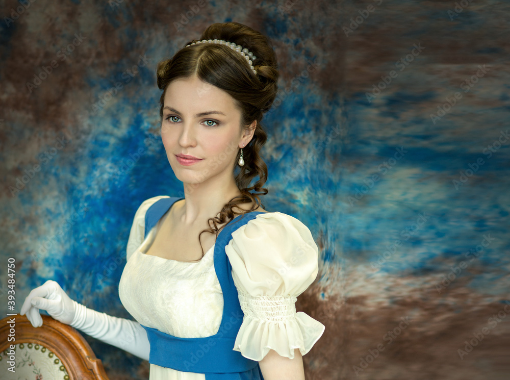 Beautiful girl in a historical dress in the Empire style of the early ...