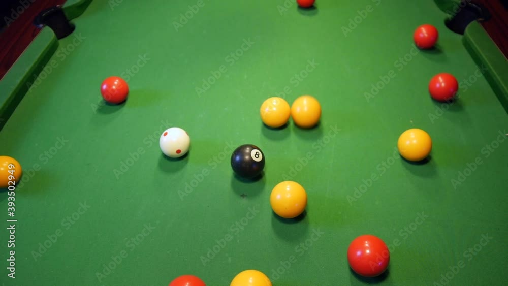 Vidéo Stock Pool balls racked in a triangle are struck by the white ...