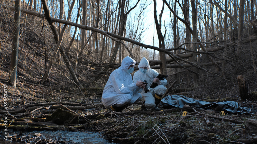 Detectives are collecting evidence in a crime scene. Forensic ...