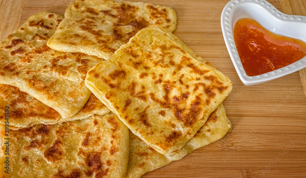 Traditional Moroccan Msemen puff pastry accompanied by peach jam ...