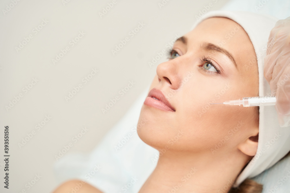 Cheek injection at spa salon. Doctor hands. Closeup view. High quality ...