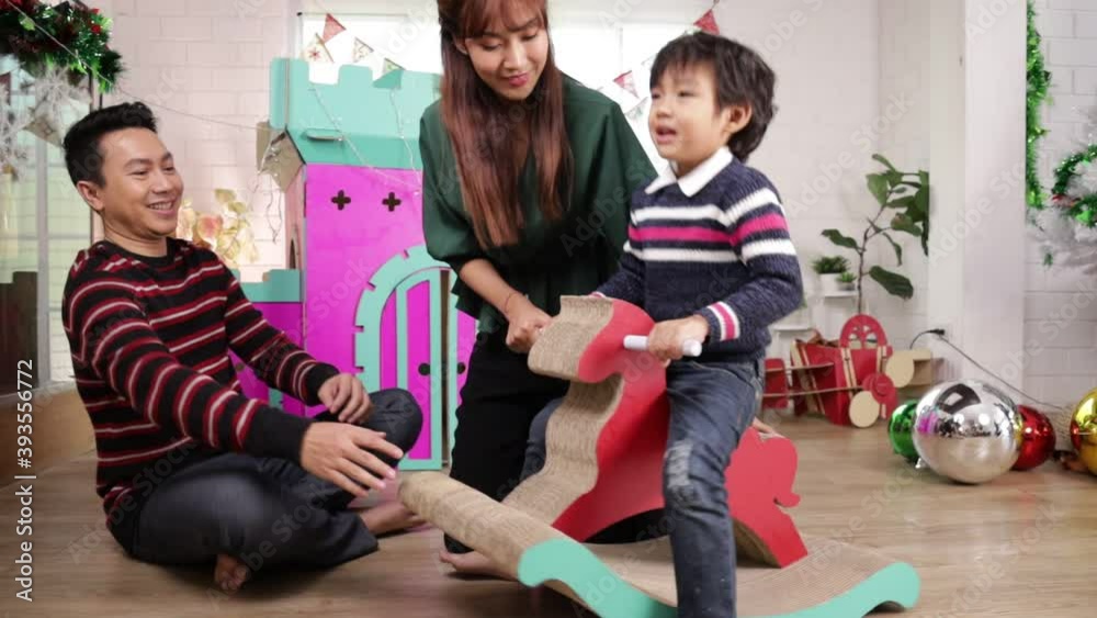 Cute kids playing while parents relaxing at home together, smiling ...