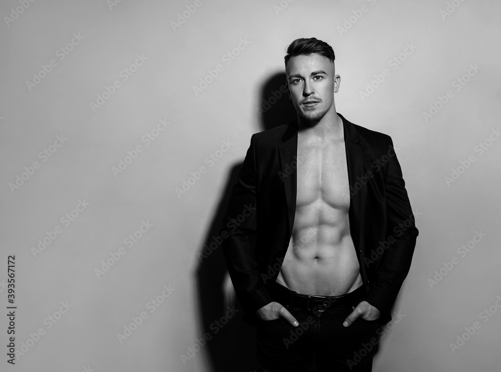 Handsome young bodybuilder with fit and athletic build wearing blazer ...