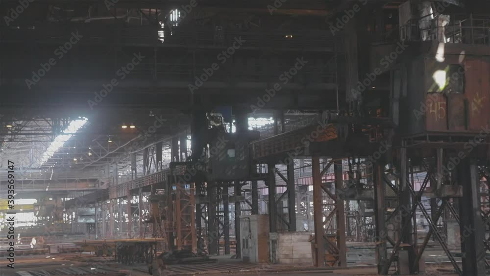 Overhead crane movement in a factory. Overhead crane in a factory ...