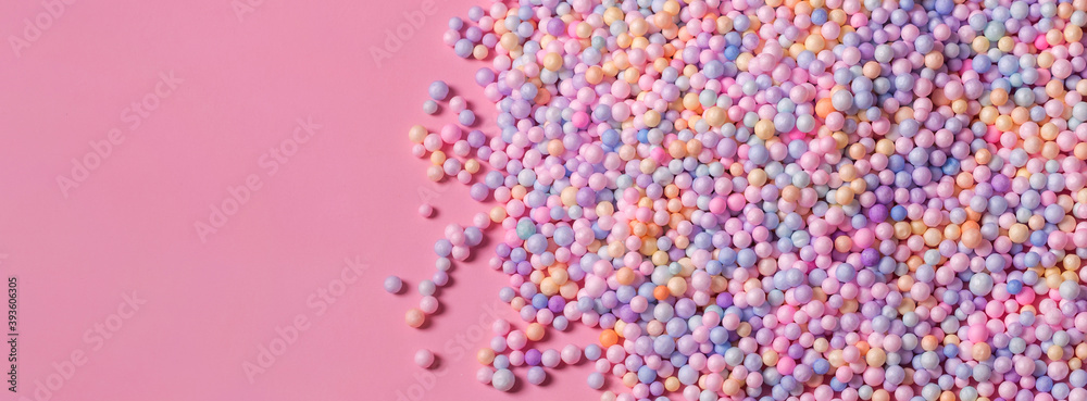 Pile of pastel color balls on pink. Styrofoam or Polystyrene foam ...