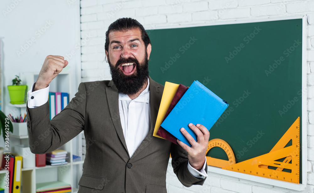 great day. learning the subject. happy man with beard holding book ...