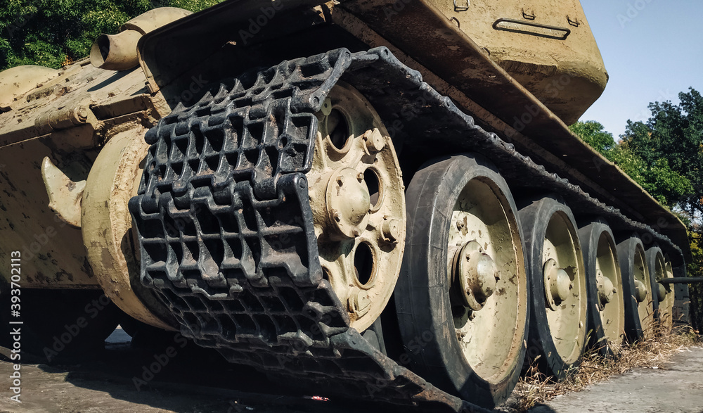 Steel black track and wheels from a Soviet military tank. Tread texture ...