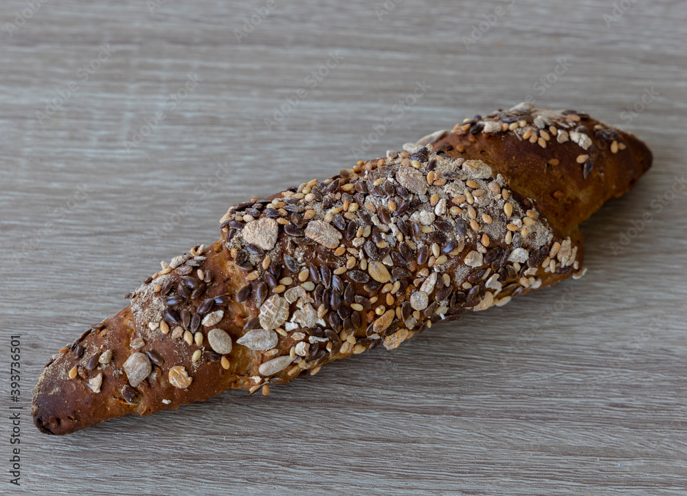Long shaped Austrian bread rolls called Kornspitz with multigrain seeds ...