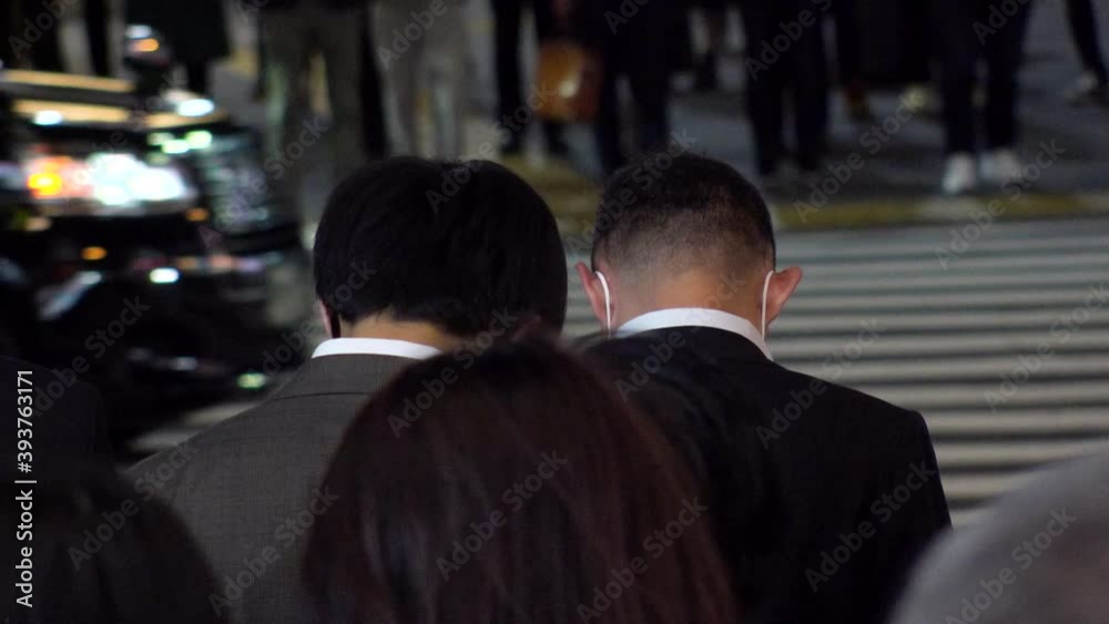 TOKYO, JAPAN : Crowd of people at the street in night time rush hour ...