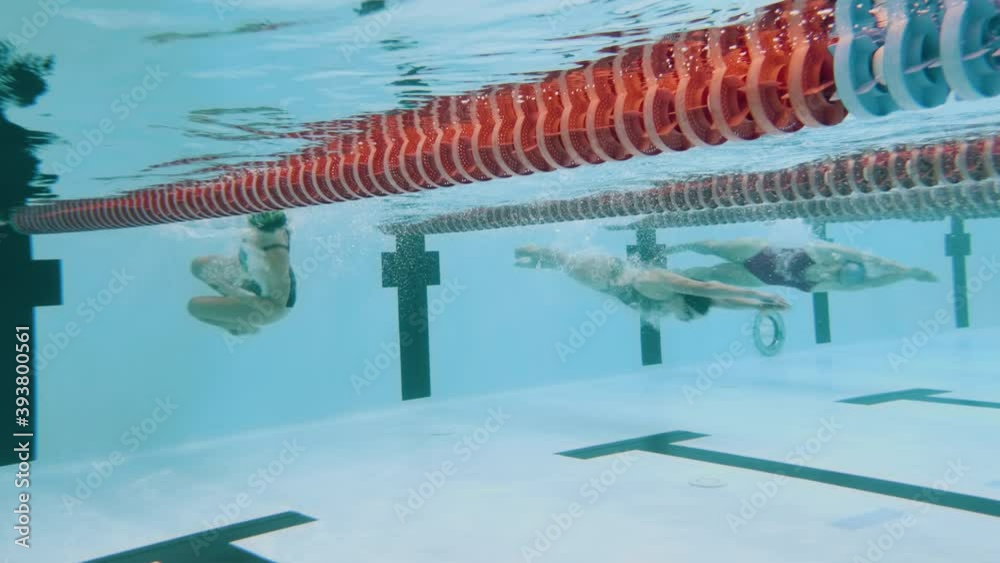 Underwater video of swimmers training breaststroke in the indoor ...