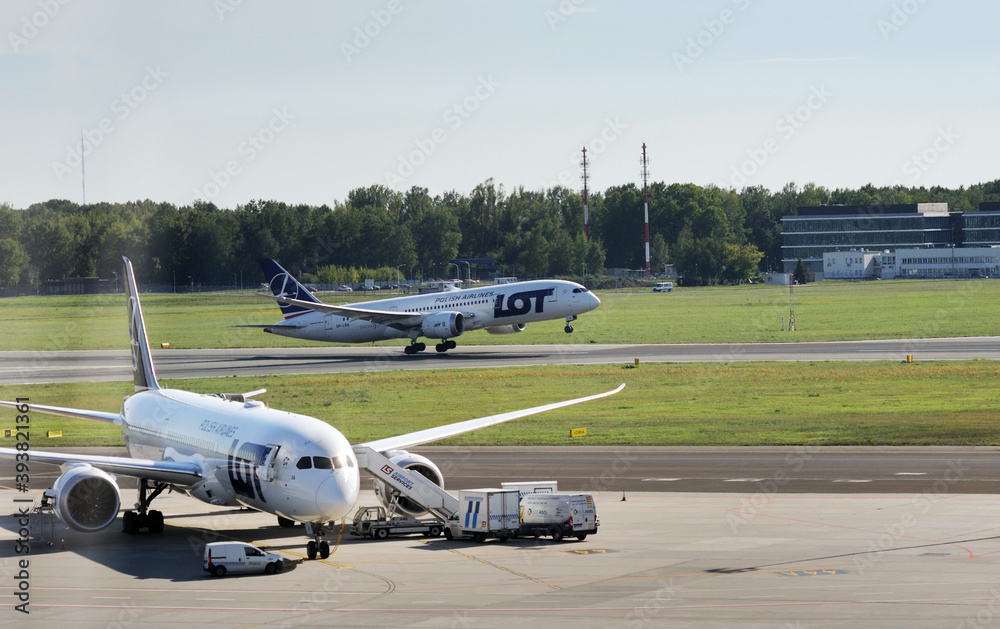 Warsaw, Poland. 15 April 2018. Passenger plane PLL LOT Boeing Dreamliner is flying up from ...