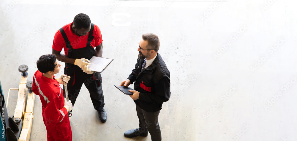 Professional car mechanic Teamwork in workshop concept. Diversity group ...