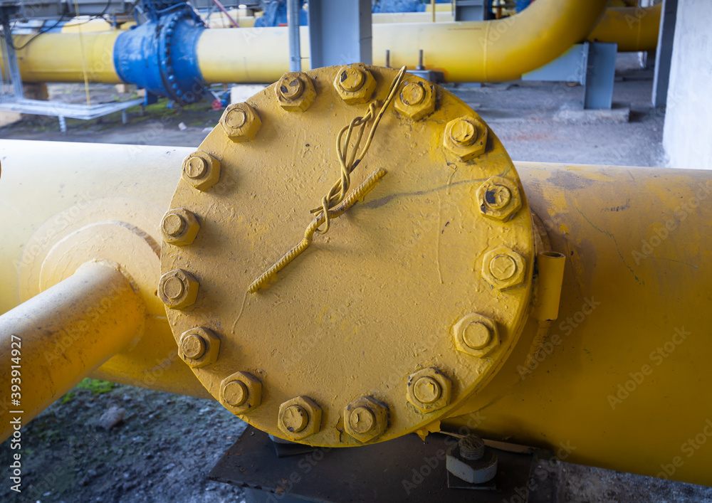 Multi-bolted manhole cover for gas pipeline inspection. Stock Photo ...