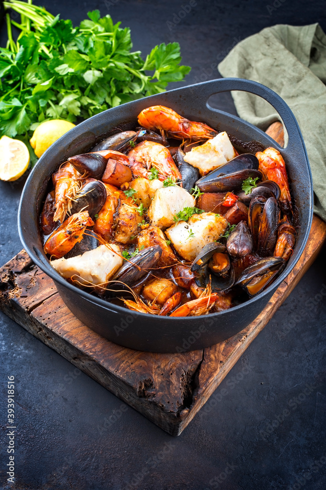 Traditional French seafood bouillabaisse with fish, king prawns and ...