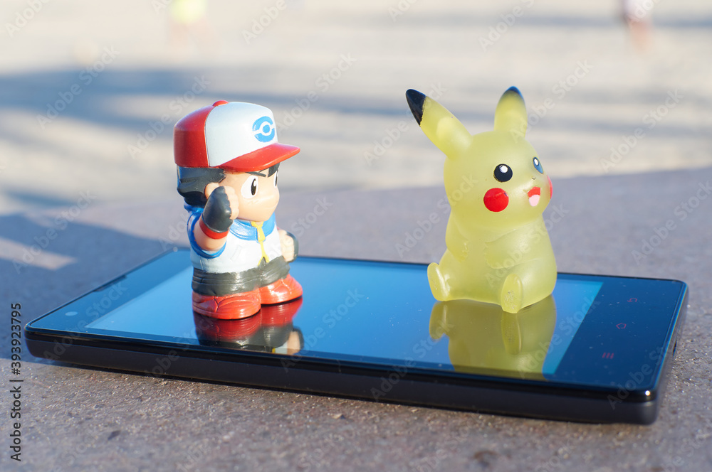 Pokemon go pikachu and Ash Ketchum real with a smartphone Stock Photo ...