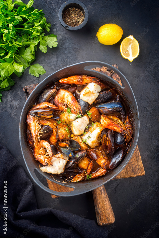 Traditional French seafood bouillabaisse with fish, king prawns and ...