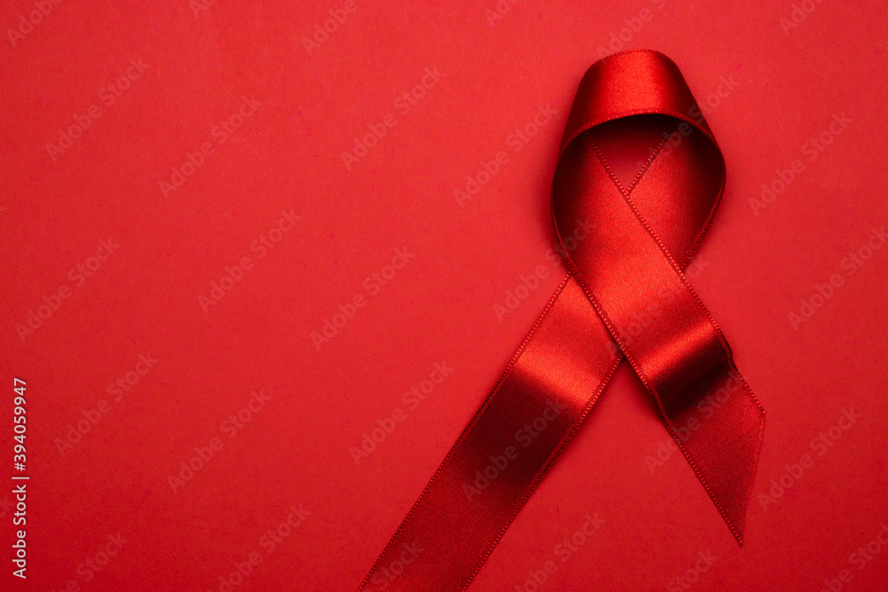 Hiv support. Red ribbon symbol in hiv world day on dark red background ...