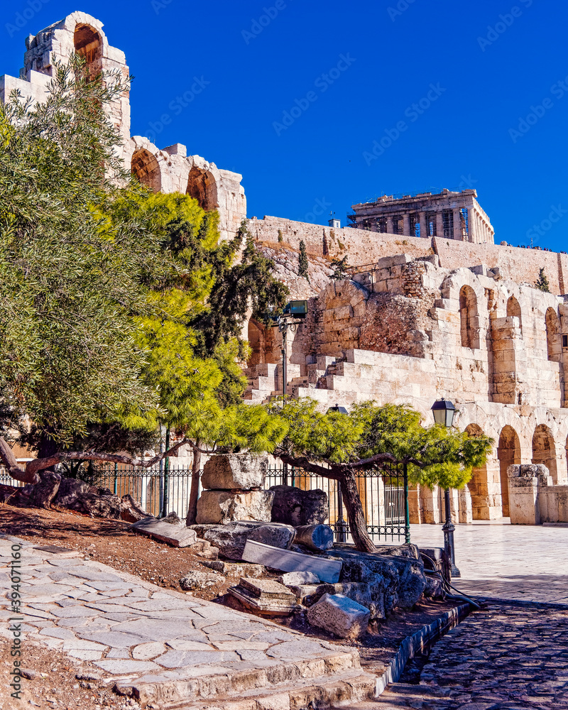 Parthenon and Acropolis walls over the arches of Herodion theater ...