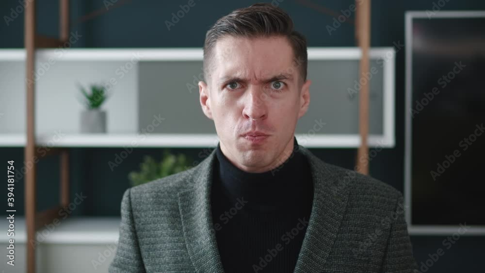 Vidéo Stock Close up angry businessman shouting and pointing at camera ...