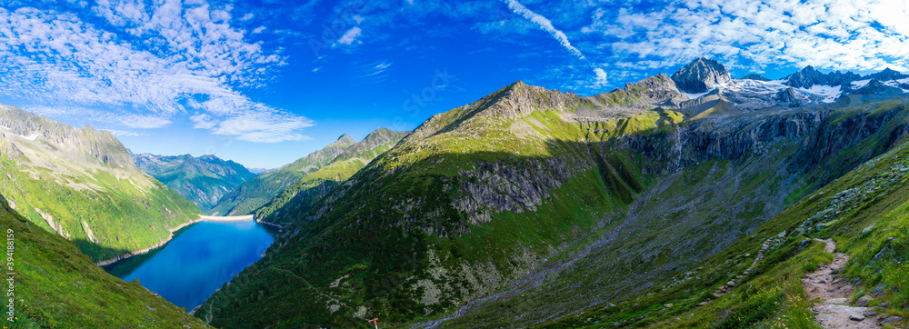 Morning mountain dawn in the Alps surrounded by summer green in the ...