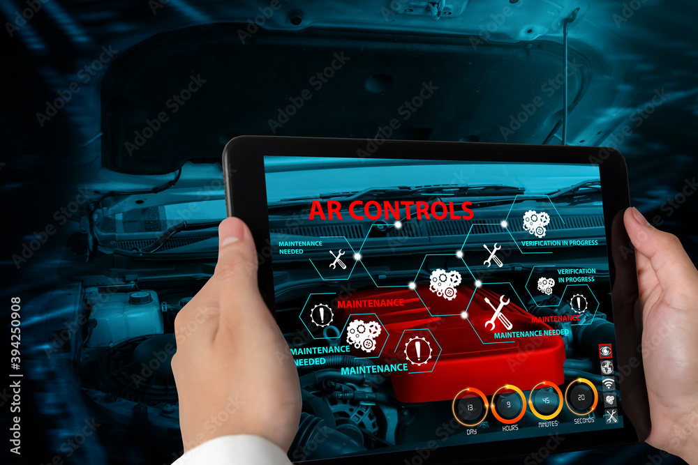 Engineer use augmented reality software to monitor parts of car vehicle ...