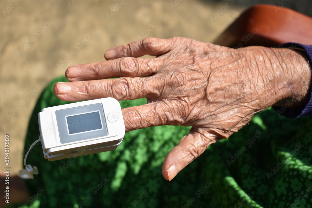 Pulse Oximeter attached with index finger of an old lady . Stock Photo ...