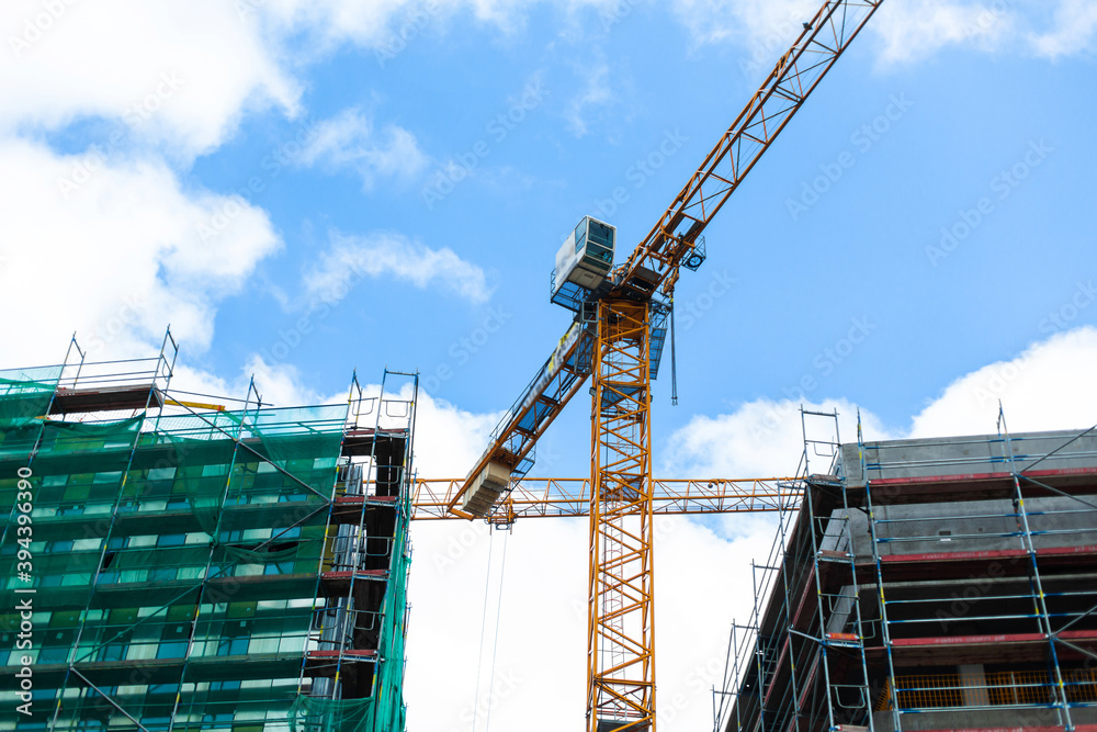 Construction site jib crane. Construction of new modern buildings ...
