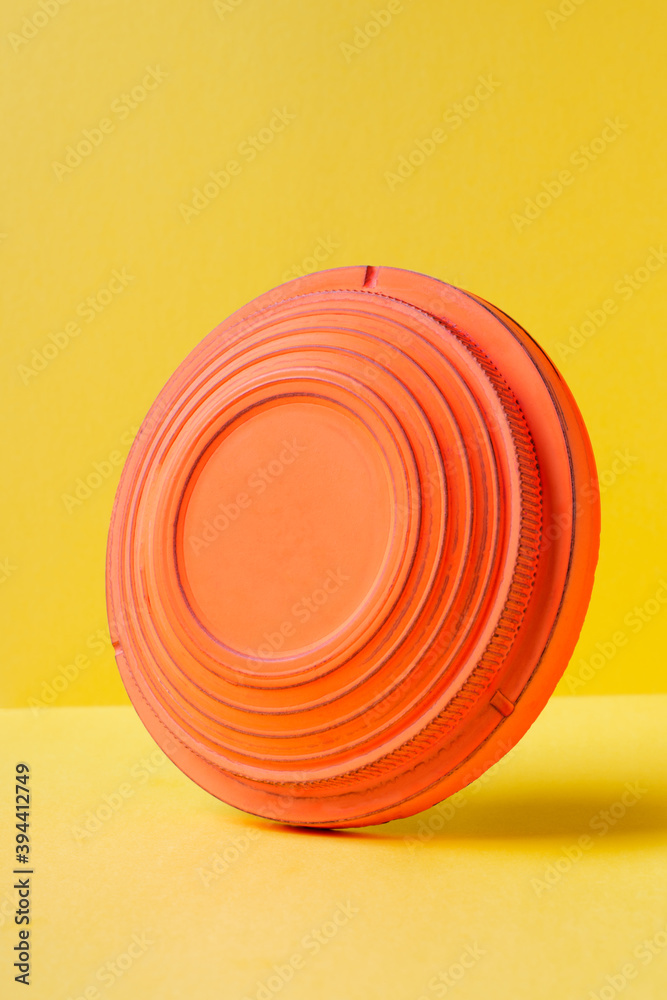 Clay disc target for skeet shooting standing edgewise against the ...