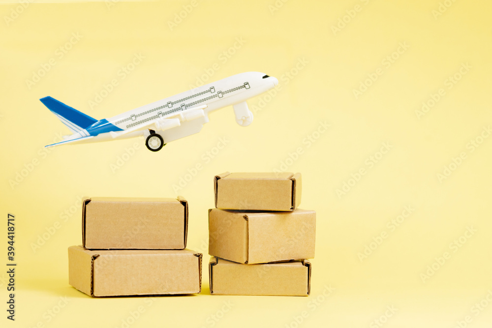 Airplane and stack of cardboard boxes. concept of air cargo and parcels ...