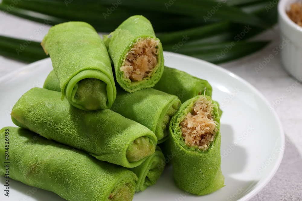 Dadar Gulung or Dadar Unti is Indonesian traditional finger food (jajan ...