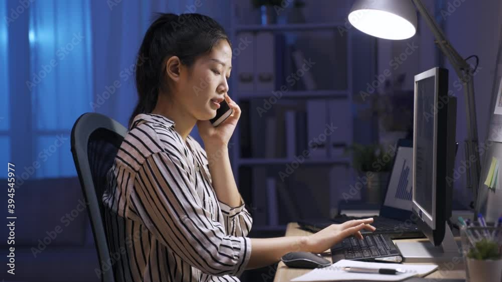 asian lady editor opening files, finger swiping on screen to check ...