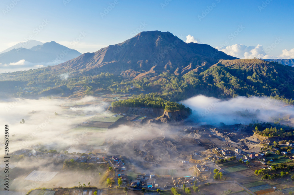 Pinggan village with Batur mount at misty morning Stock Photo | Adobe Stock
