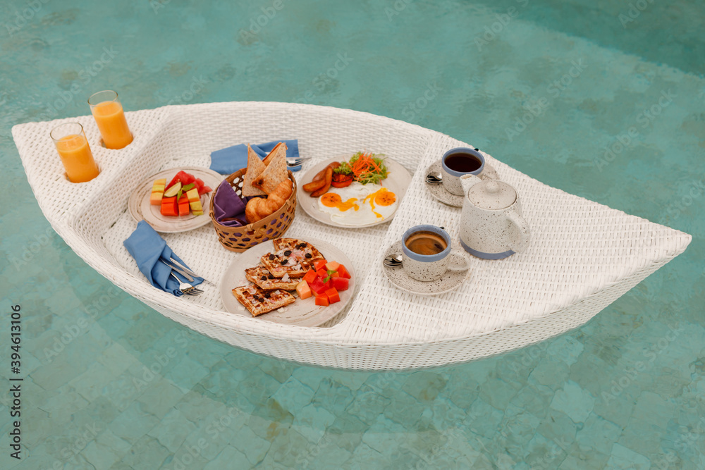 Floating breakfast set in tray with fried egg, waffles bread , fresh ...
