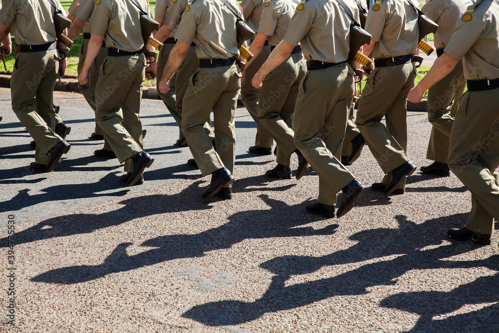 Shadows and legs of marching soldiers in the Australian Defense Force ...