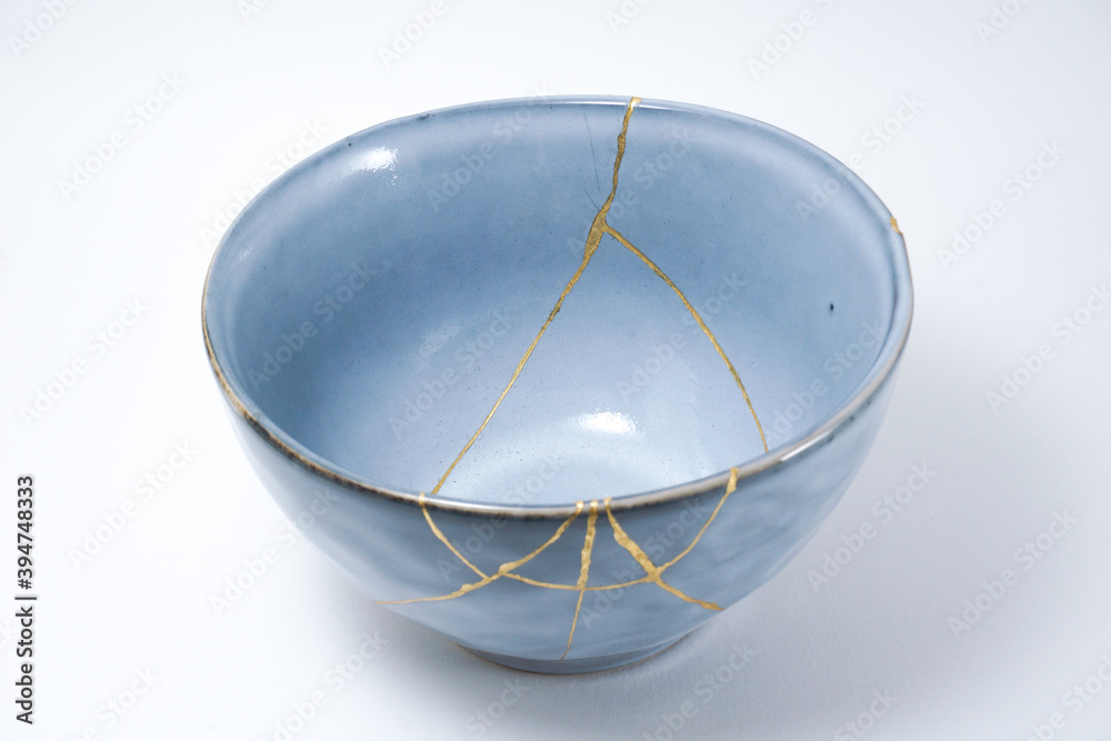 Blue kintsugi bowl. Gold cracks restoration on pottery restored with ...