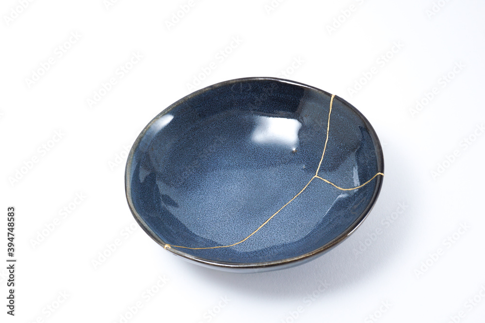 Blue kintsugi bowl. Gold cracks restoration on pottery restored with ...