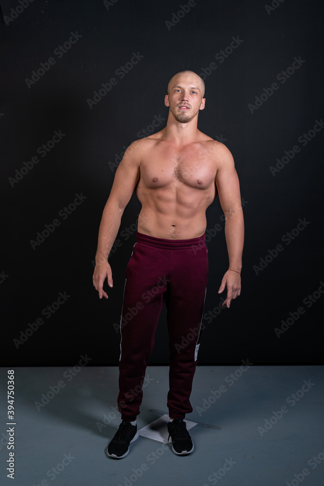 Athletic, beautiful strength in training pumps up muscles. Strong ...