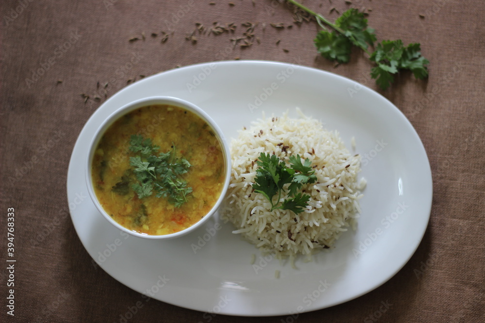 Jeera rice served with dal fry, a popular north Indian food Stock Photo ...