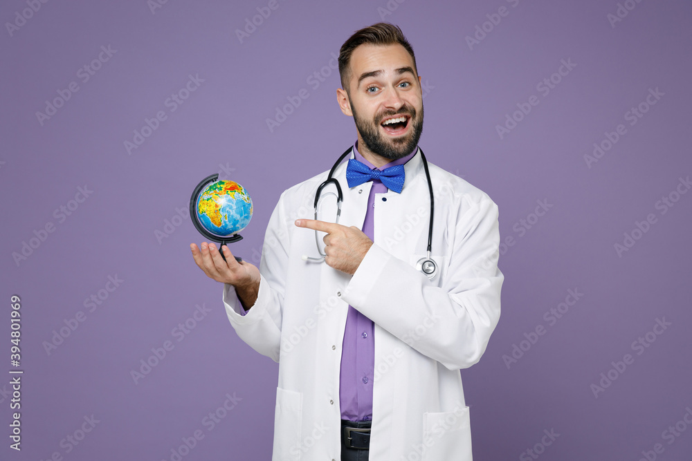 Excited young bearded doctor man in white medical gown stethoscope ...