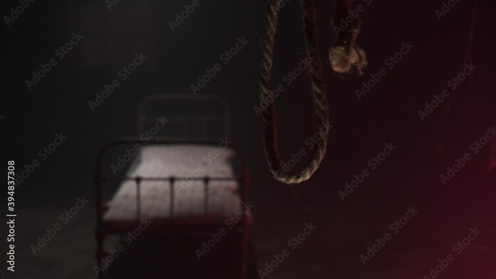 scary noose gallows for execution swings in dark against background of ...