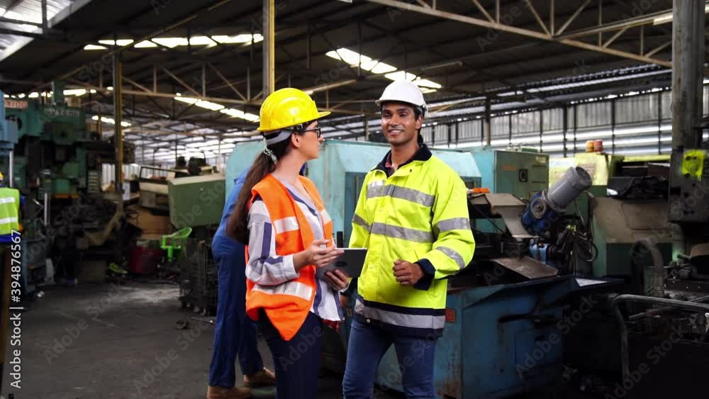 Engineer checking and controlling automatic machine in the industry ...