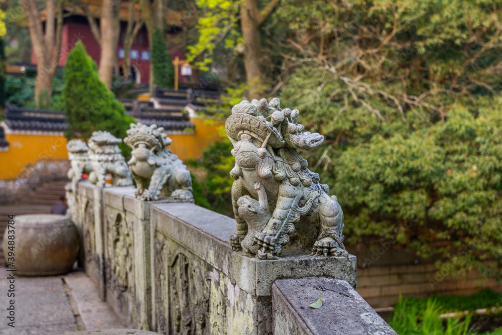 Animal statue on the handrail of the bridge to Fayu temple in the ...