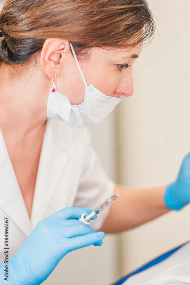 Cosmetic surgery on the skin of the face - intramuscular injection of a ...