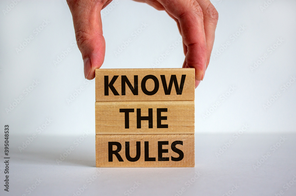 Know the rules. Wooden blocks tower with words 'know the rules', male ...