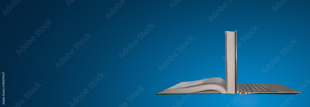 Banner with modern laptop computer positioned back to back with a thick ...