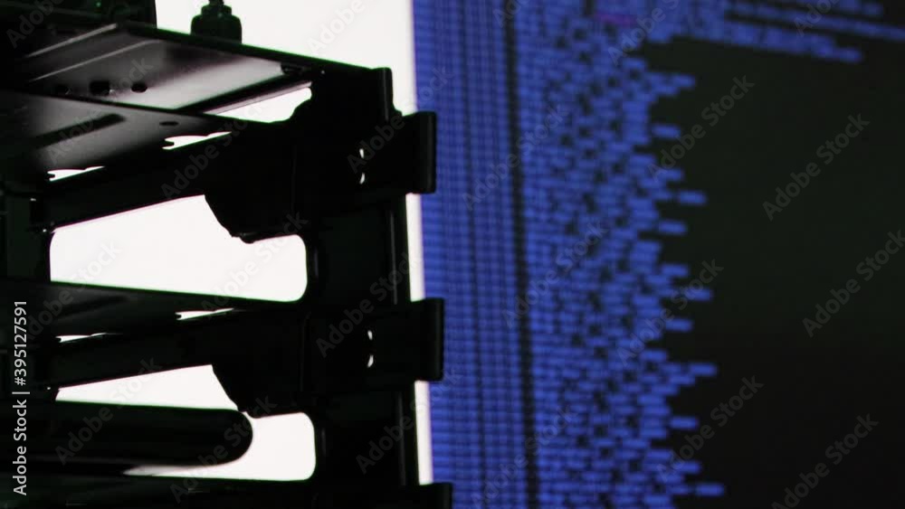 Blue Computer Software Code Moving On A Black Monitor Reflect On Glass Abstract Computer