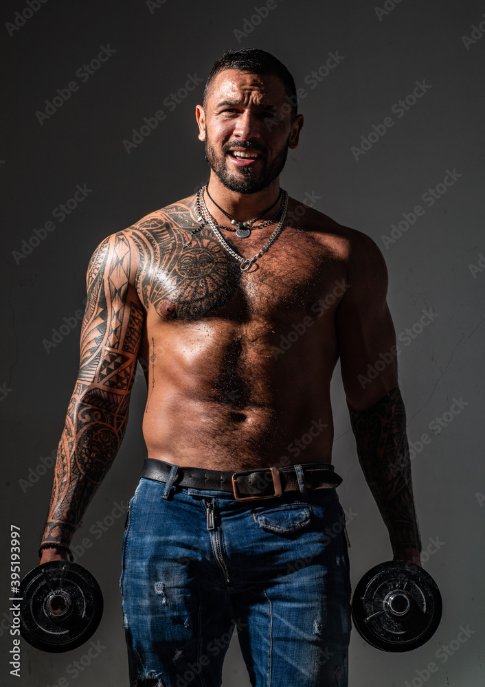 Strong handsome sport man making weightlifting and exercising the ...